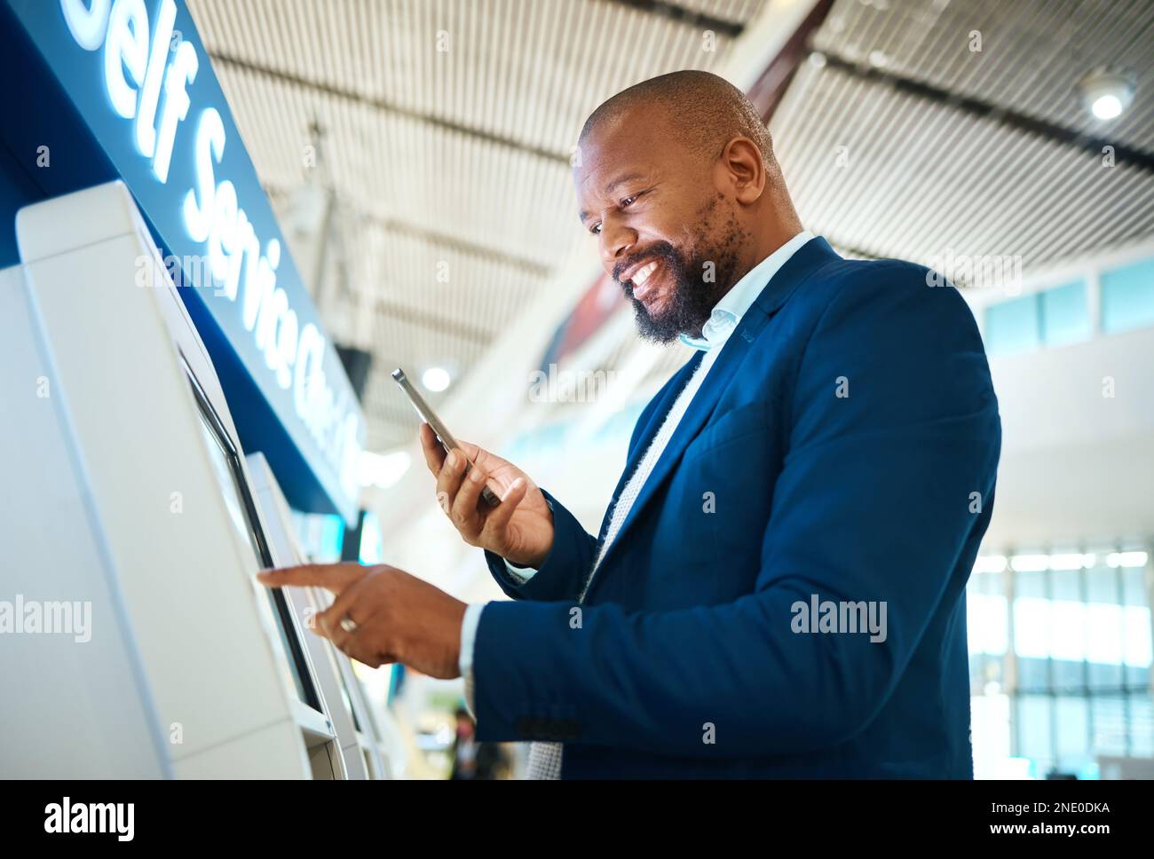 Airport ticket, self service and man with phone for online booking ...