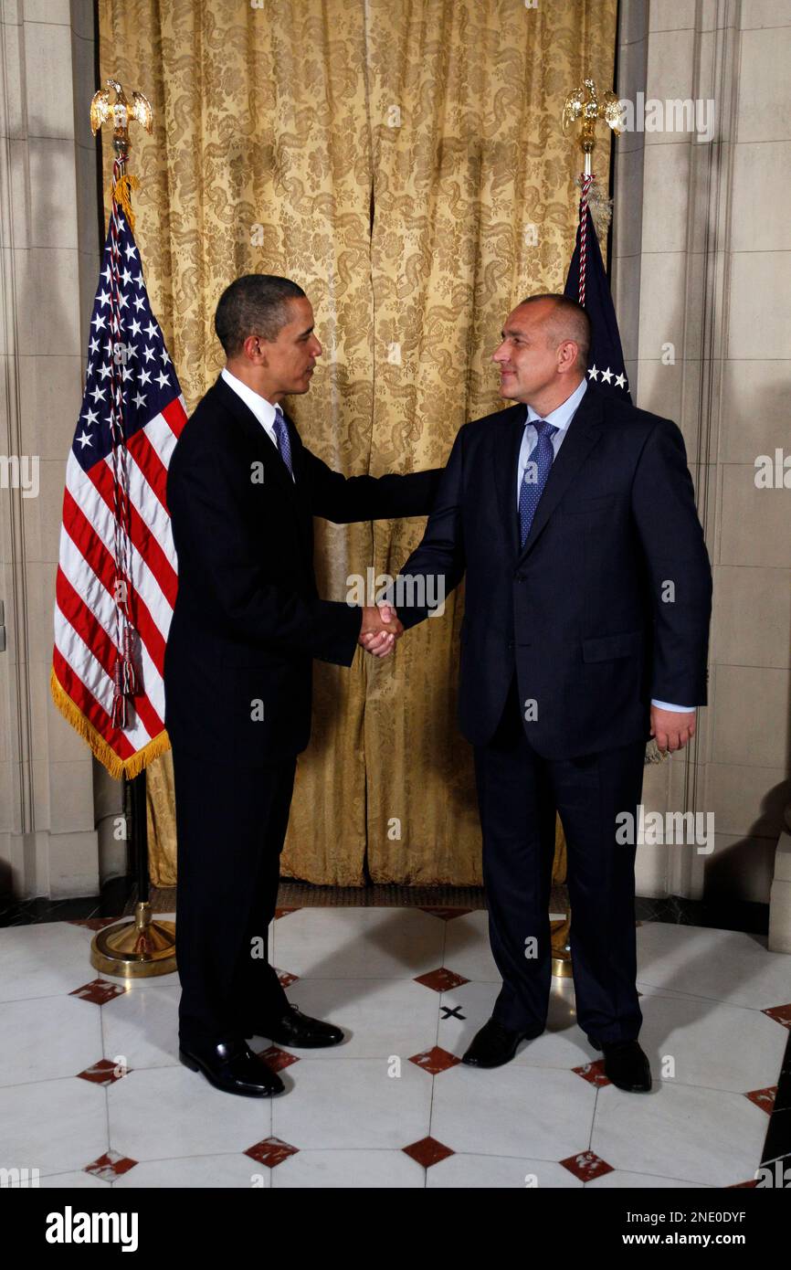 President Barack Obama, left, shakes hands with the prime minister of ...