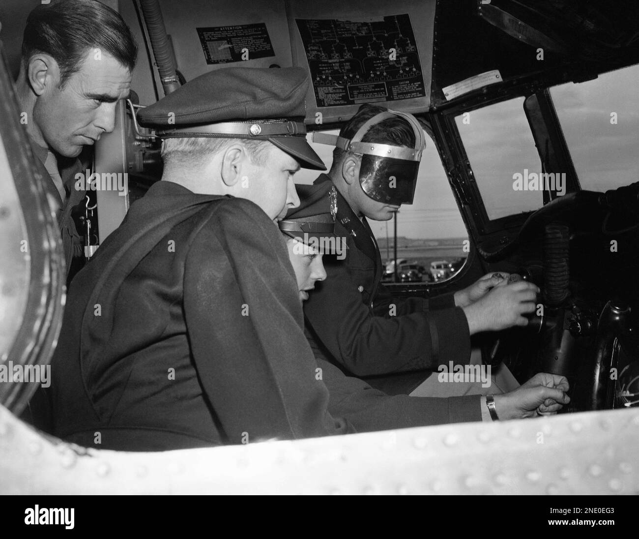 Capt. Royal Monville, right, wearing a blue mask to prevent him from ...