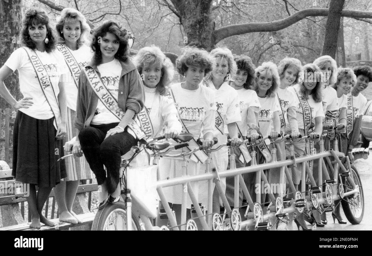 Fourteen contestants for the upcoming Miss USA Pageant pose beside a ...