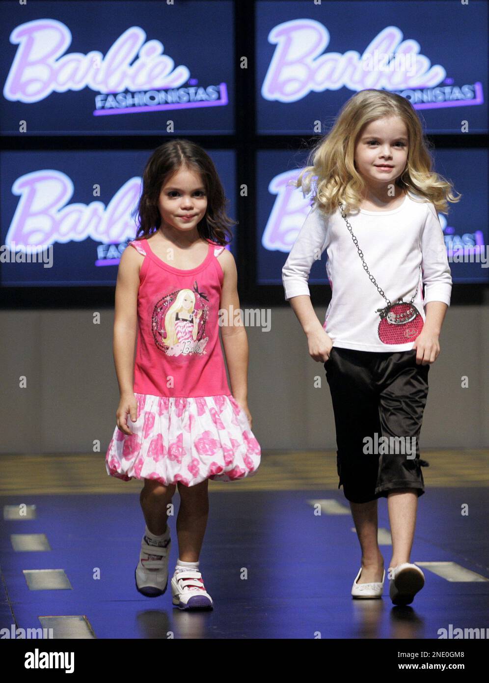 Girls present a Spring/Summer Barbie Kids Apparel Collection during the ...