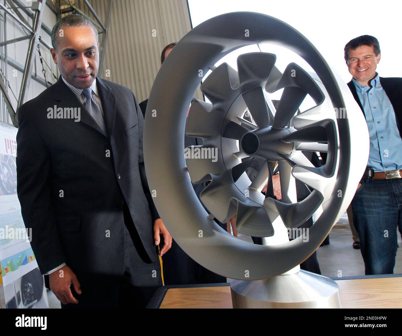 Mass. Gov. Deval Patrick, left, looks at a prototype of a shrouded wind ...