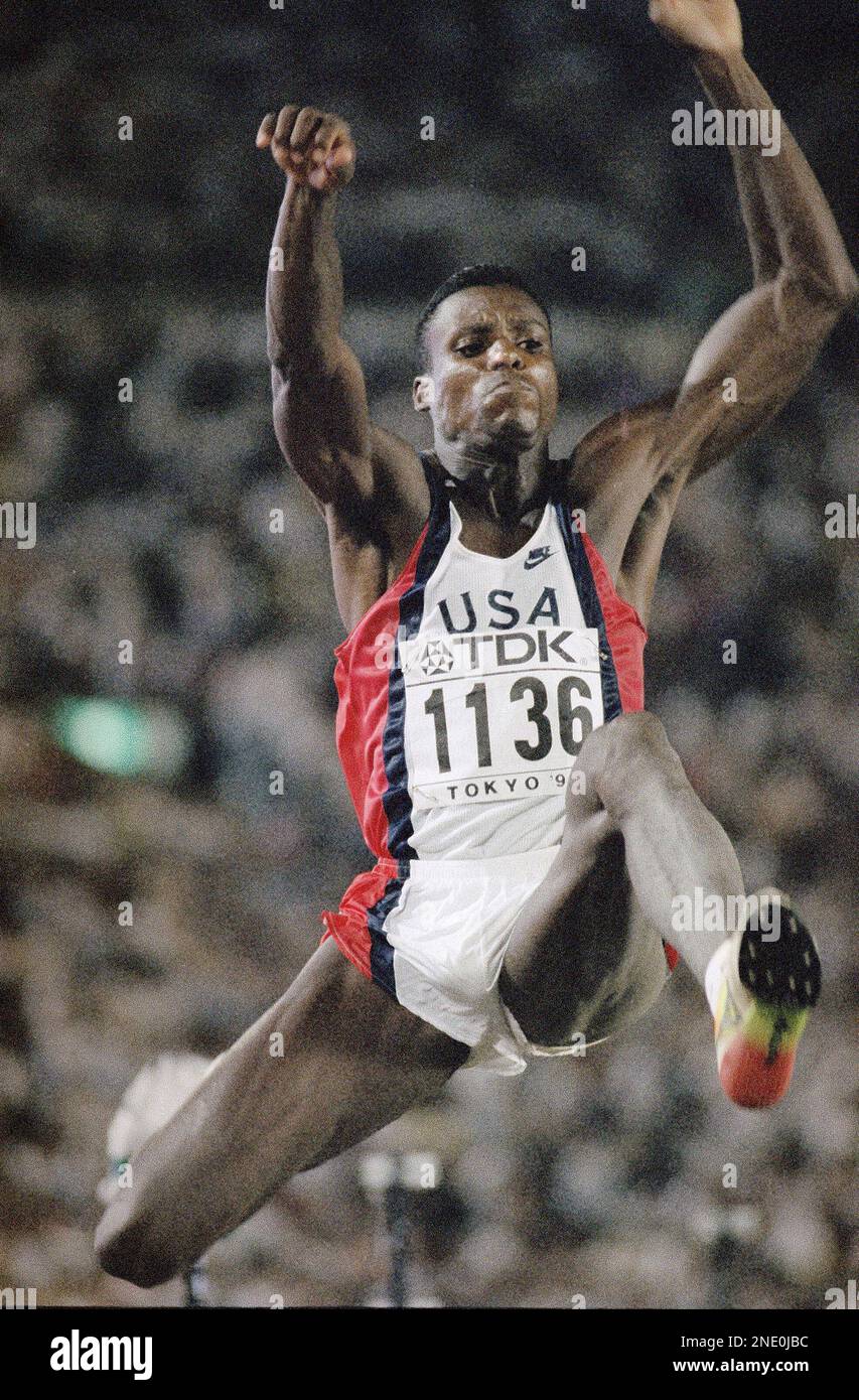 Carl Lewis of the U.S. soars through the air in the long jump final at ...