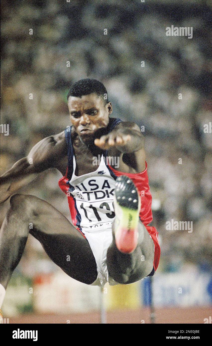 Carl Lewis of the U.S. soars through the air in the long jump final at ...