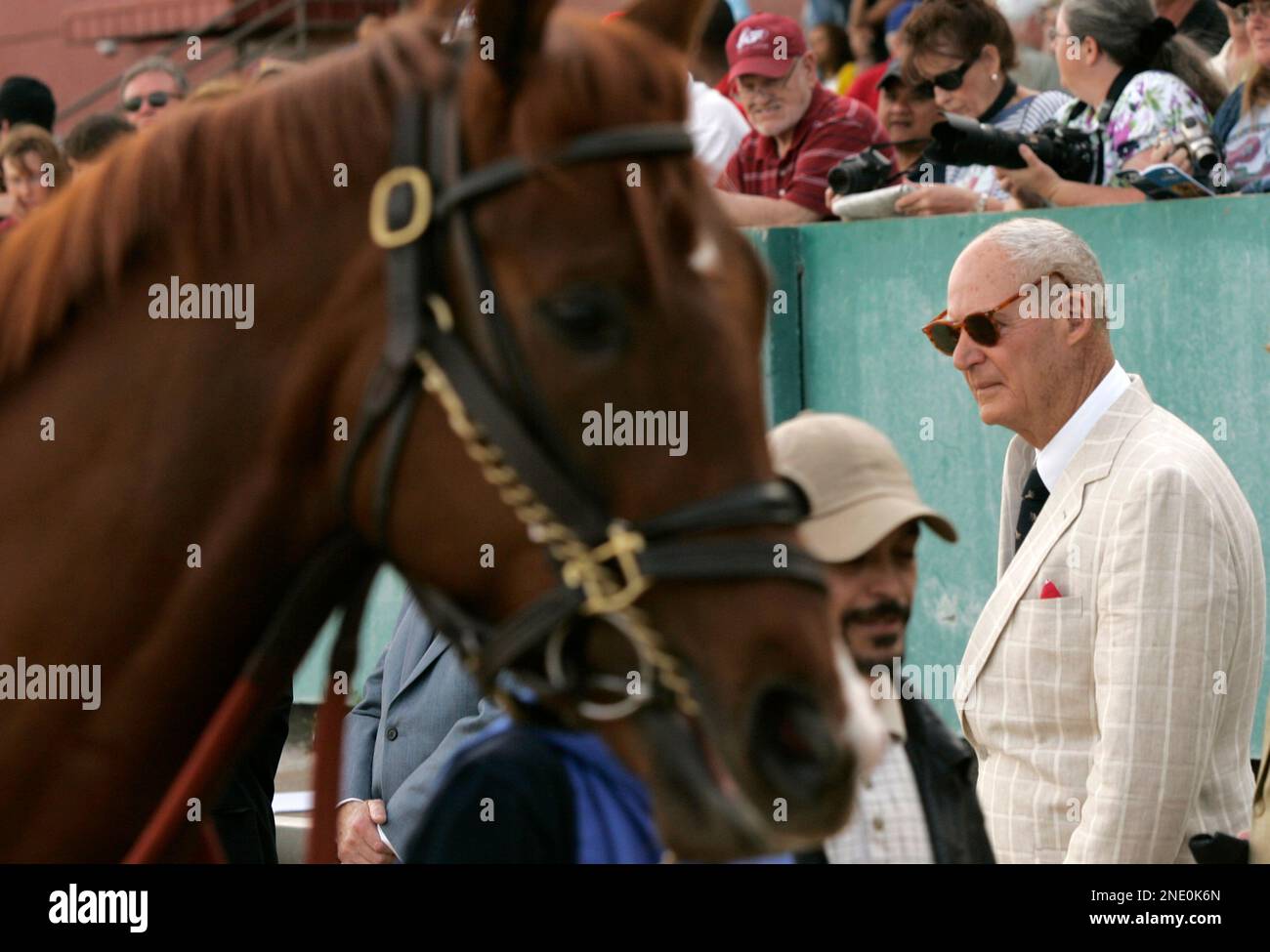 In this photo taken April 3, 2010, Charles Cella, far right, watches ...