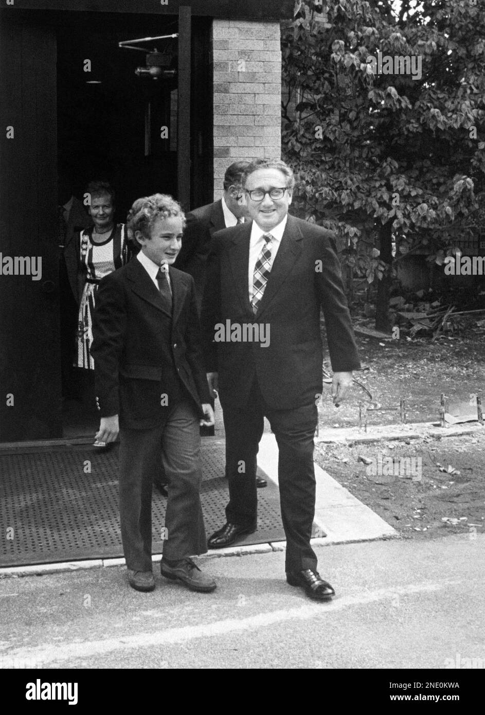 Secretary of State Henry Kissinger with his son David, 13, following a ...