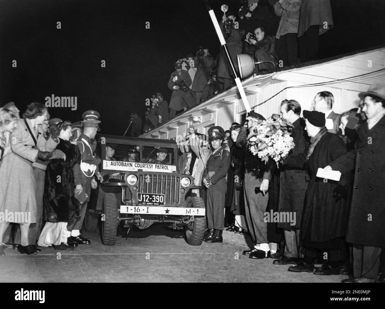 The first vehicle, a U.S. army jeep, rolls out of West Berlin toward ...