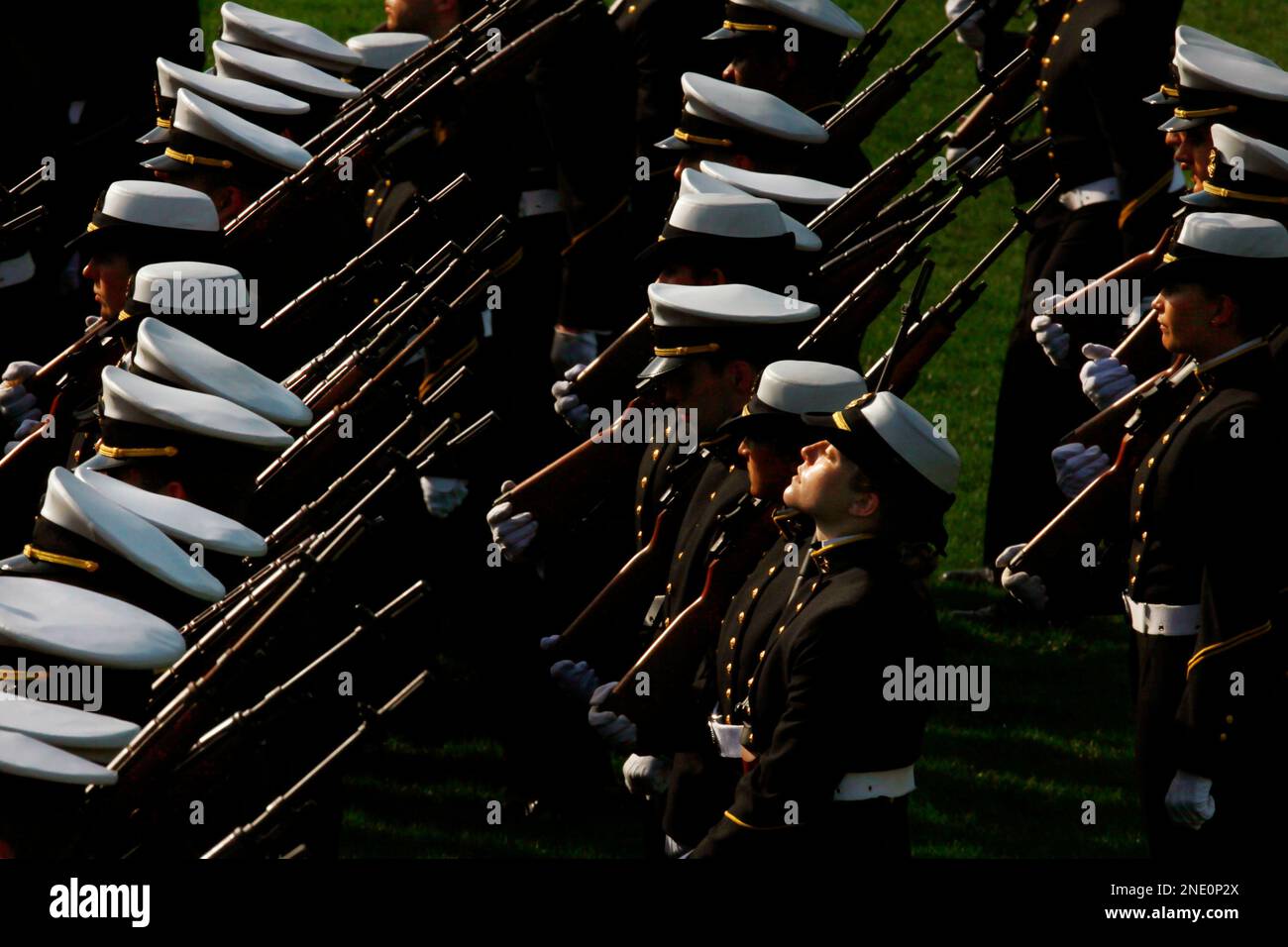 A midshipman lifts her face to the sun at the end of a formal dress ...