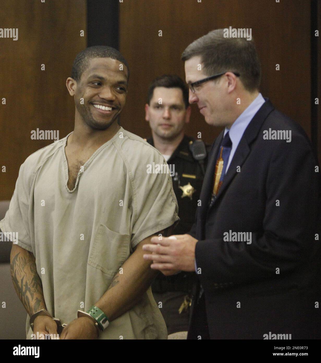 Ex-Ohio State football star Maurice Clarett, left, smiles as he looks ...