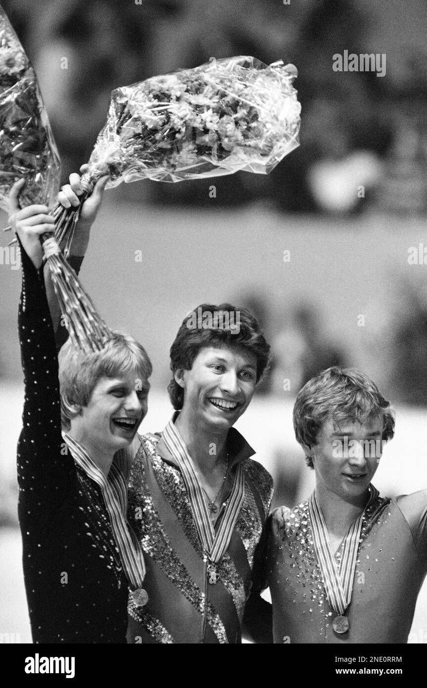 Gold medal winner Norbert Schramm, center, from West Germany shares a ...