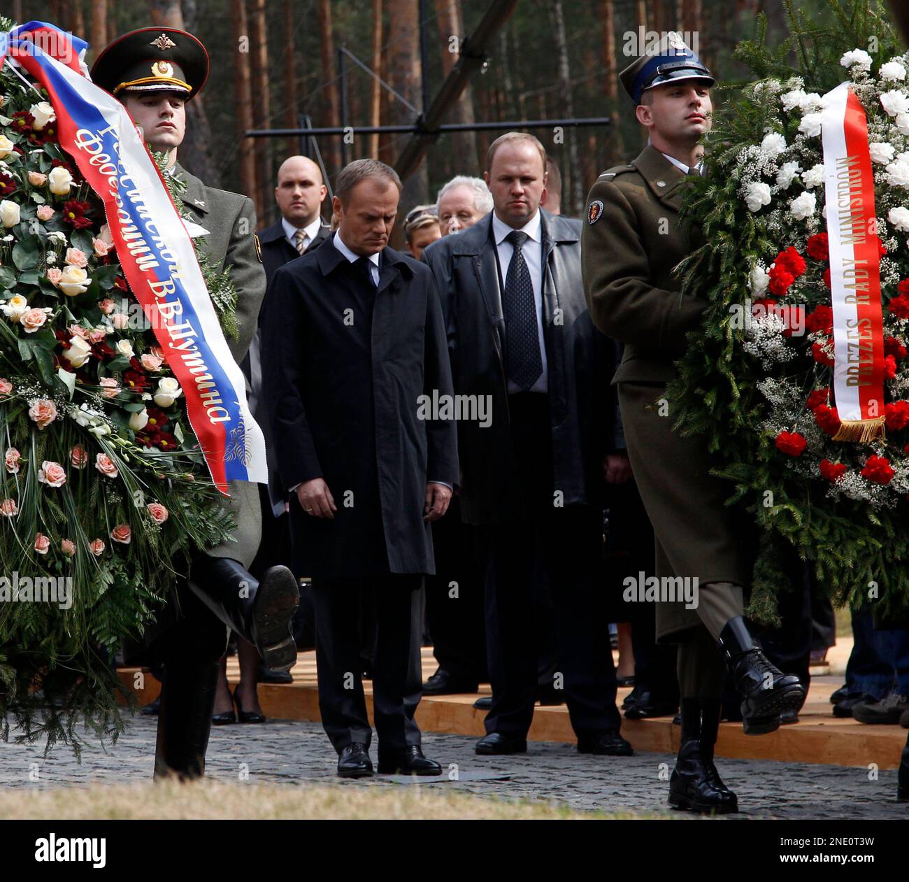 Polish Prime Minister Donald Tusk, center, attend a memorial ceremony ...