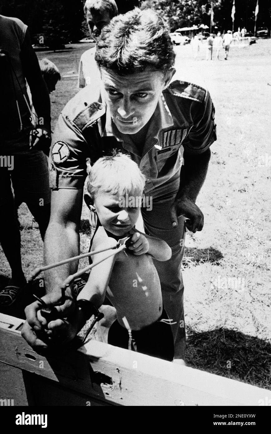 An Afrikaners Weerstandsbeweging (AWB) supporter teaches his son to ...