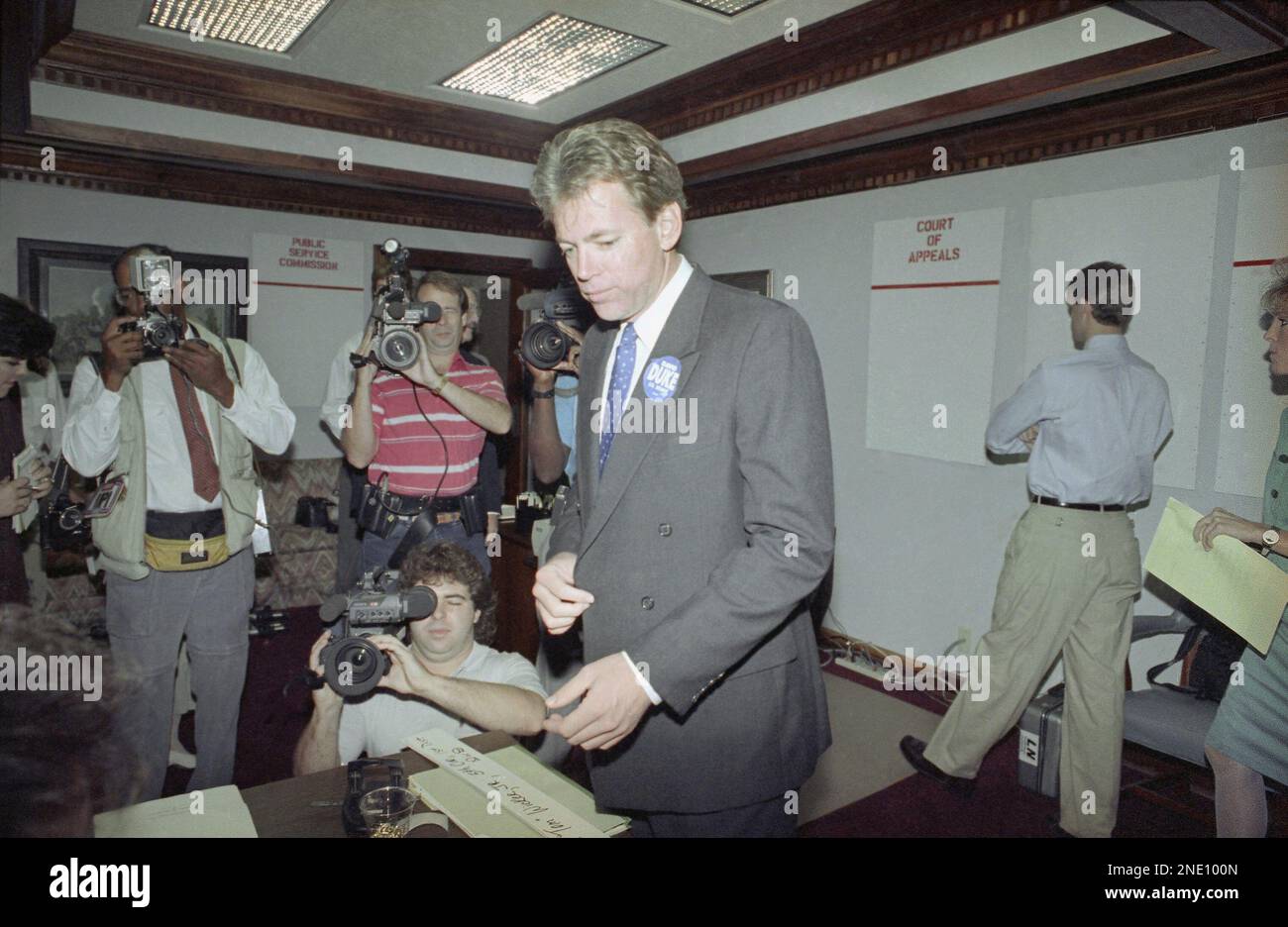 Louisiana State Rep. David Duke reaches for qualifying papers in the ...