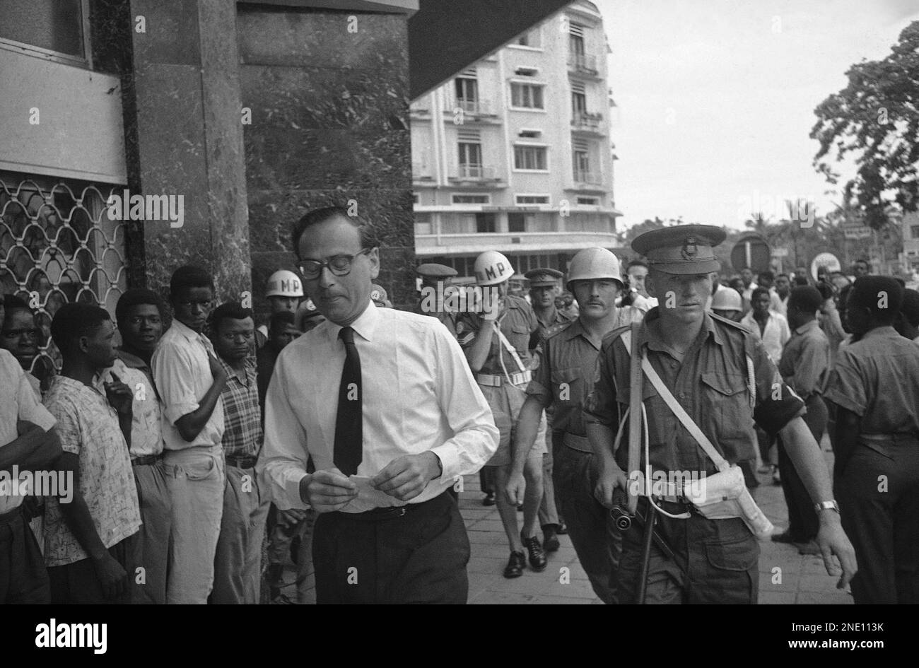 Associated Press correspondent Michael Goldsmith, 39-year-old British subject, is escorted from ...