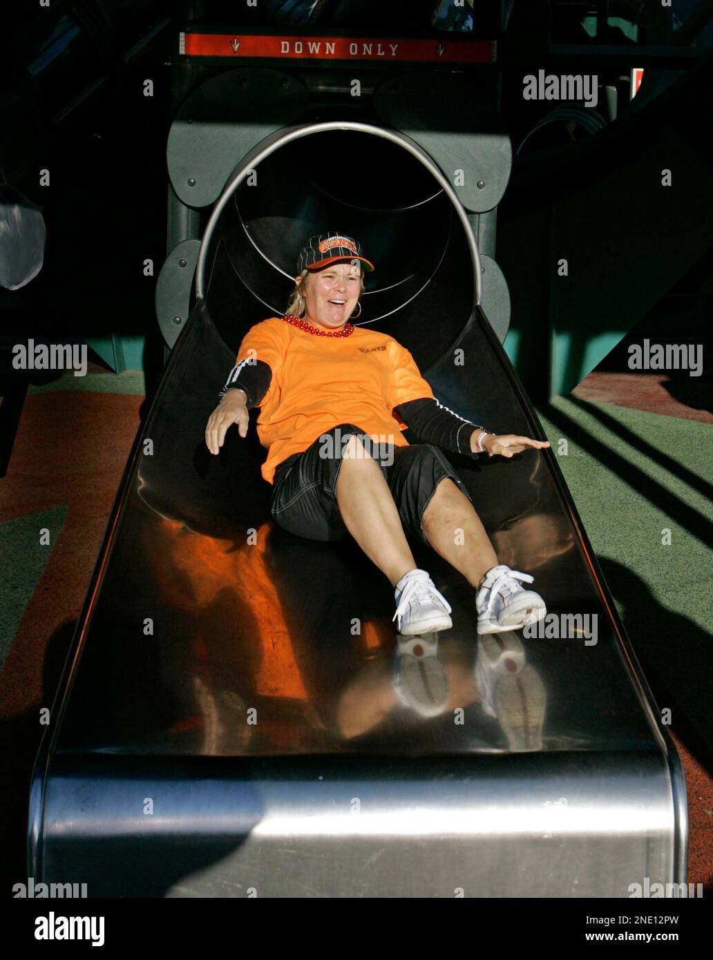In this Aug. 5, 2006, photo, a woman reaches the bottom of a slide ...
