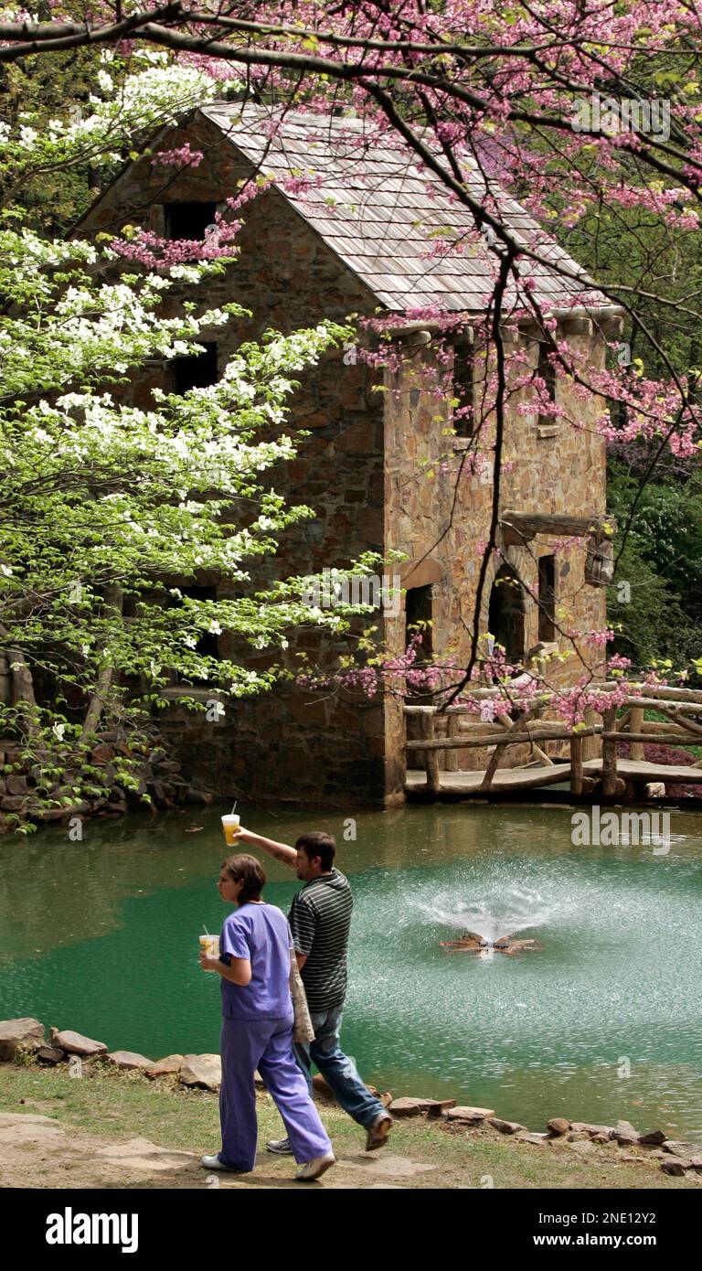 Crystal and Robert Smith of Ward, Ark., stroll past The Old Mill in ...