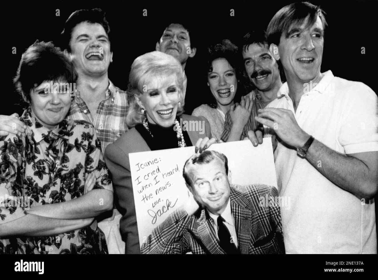 Comedian Joan Rivers, center, holds up a poster of Jack Paar, former host of NBC's "Tonight Show ...