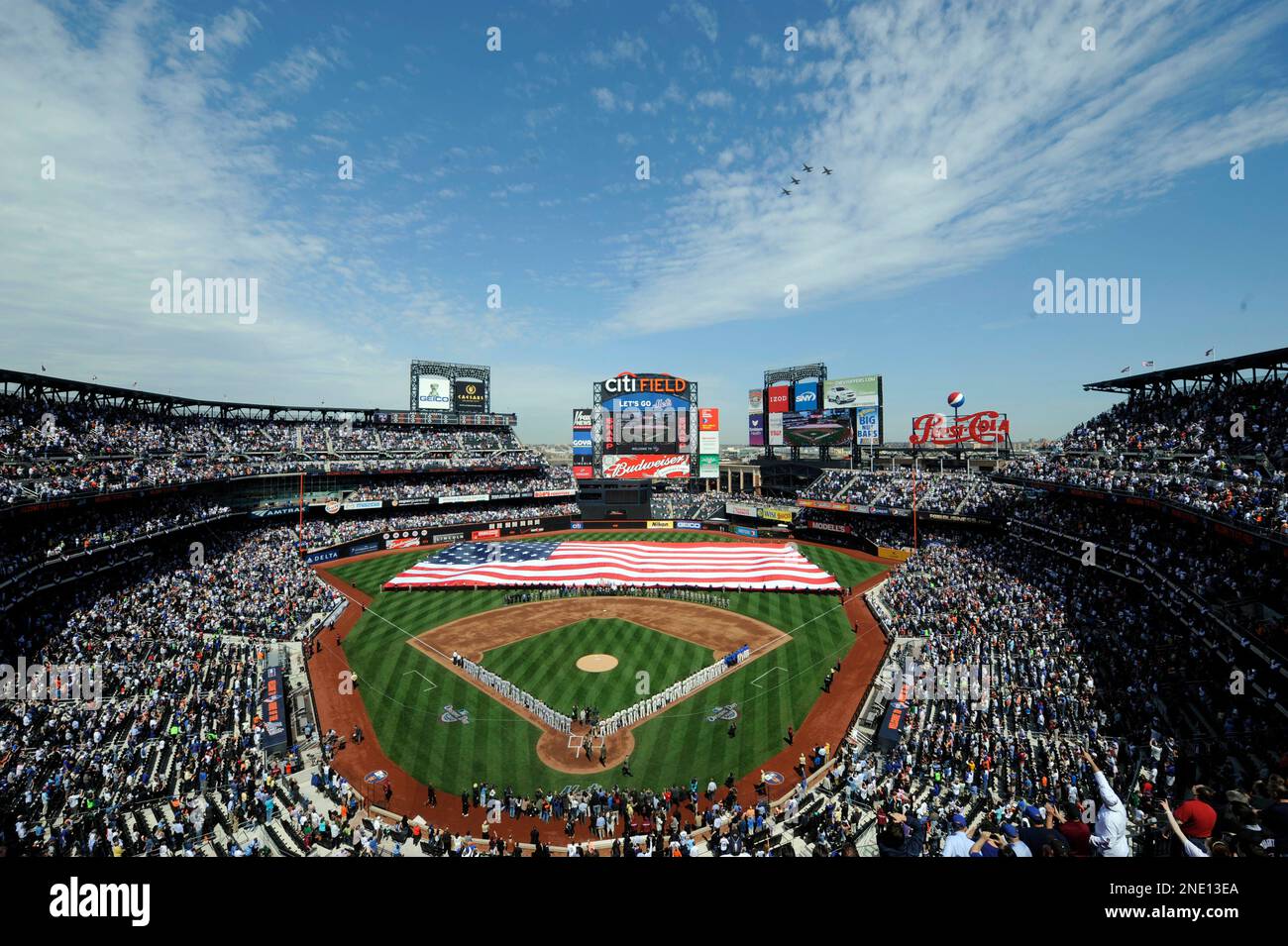 A squadron of fighter jets flies over Citi Field before the start of ...