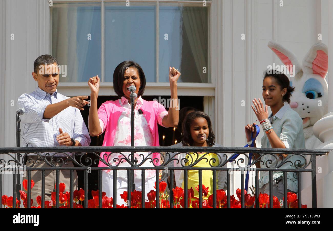 President Barack Obama standing with first lady Michelle Obama ...