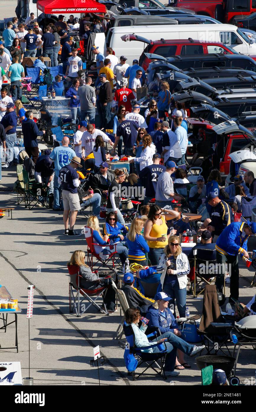Fans tailgate in the parking lot of Miller Park before the opening day ...
