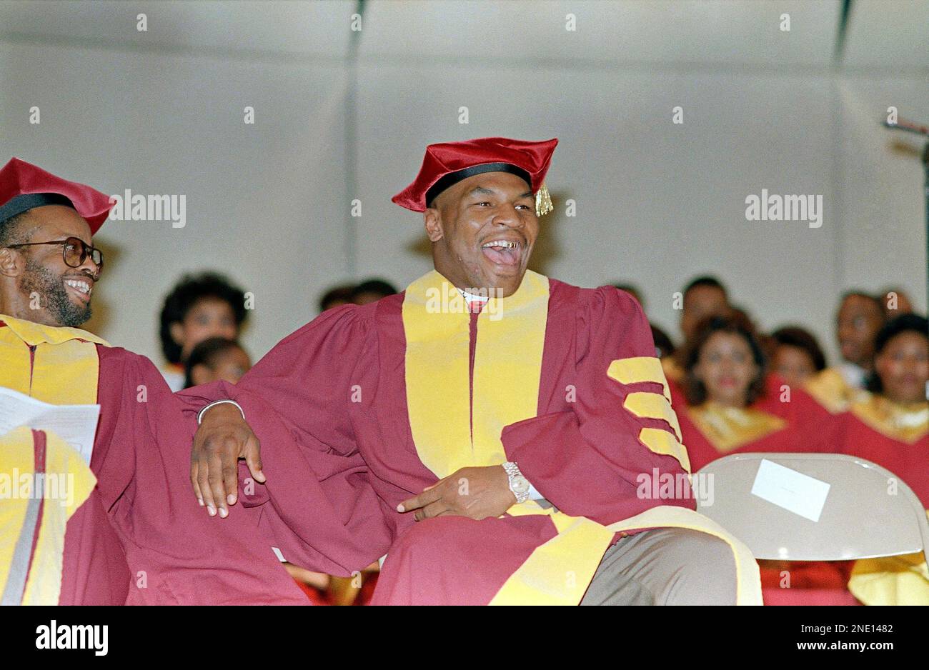 Heavyweight boxing champion Mike Tyson enjoys a laugh during a ...
