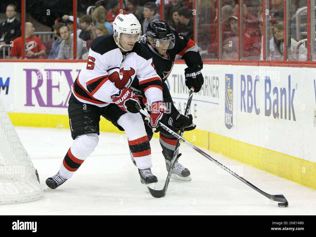 New Jersey Devils' Andy Greene (6) and Carolina Hurricanes' Sergei ...