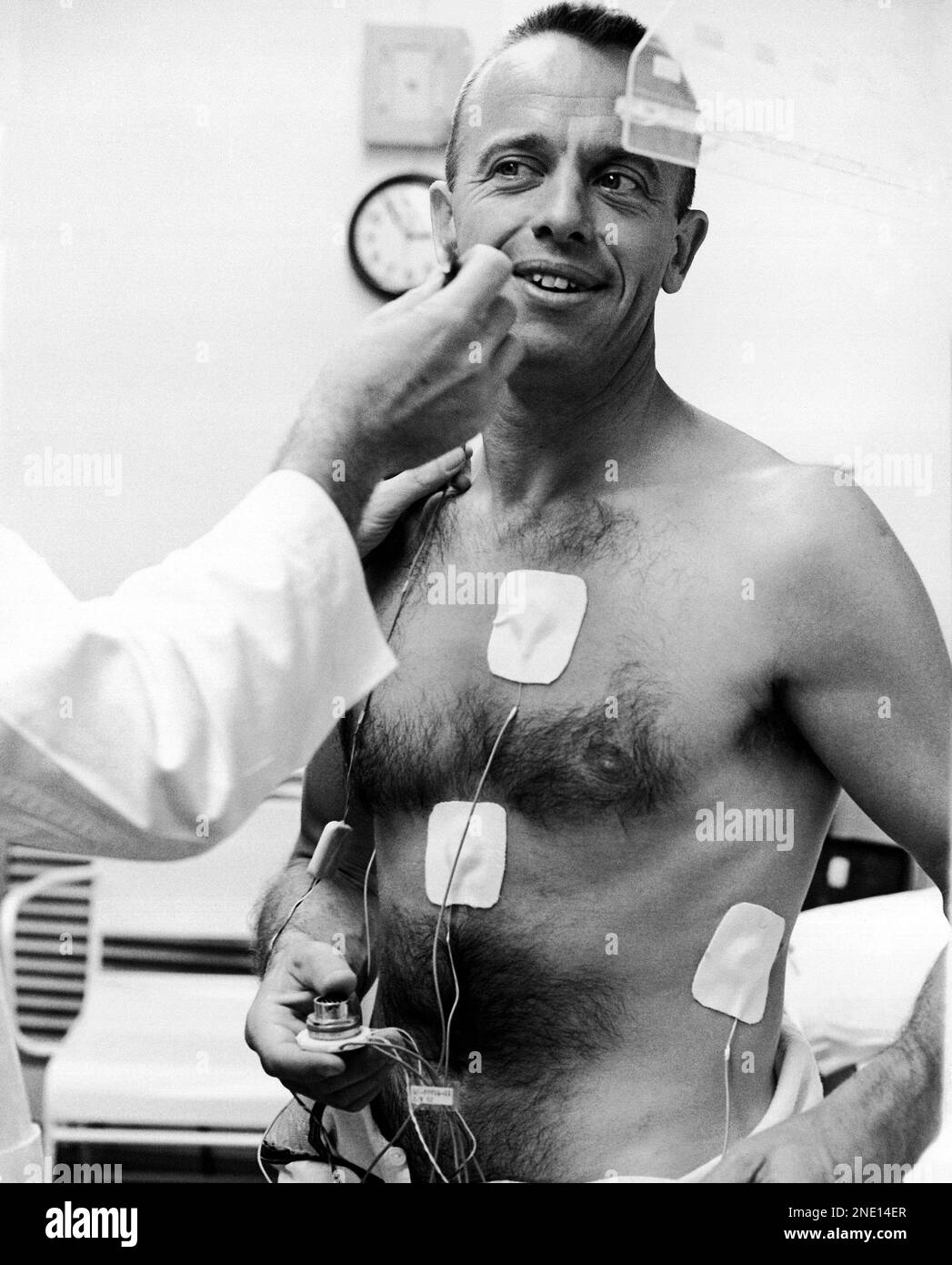 Sensors are attached to body of astronaut Alan B. Shepard Jr. just ...