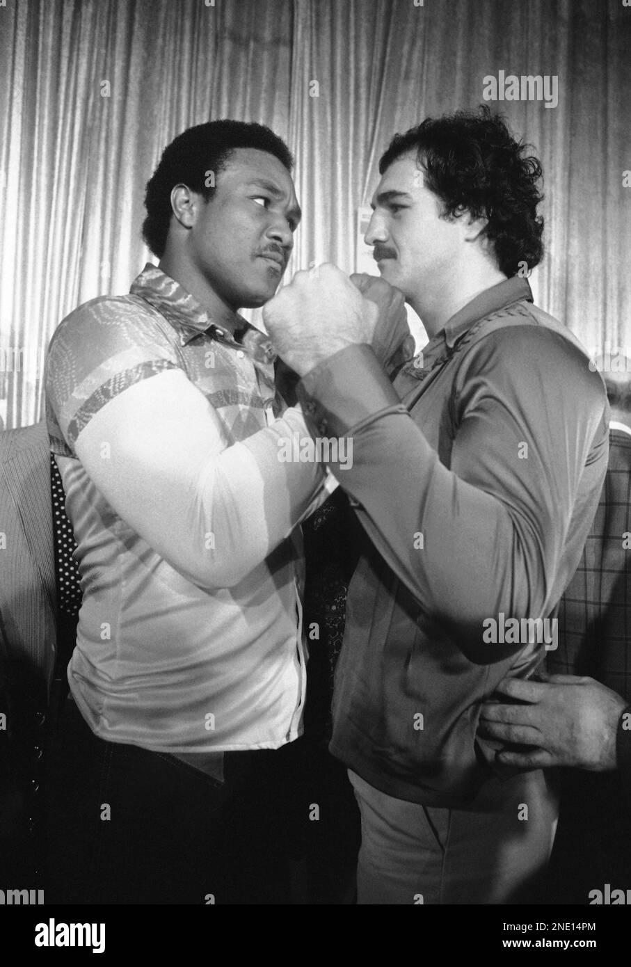 Former heavyweight champion George Foreman, Left, shows the fist that ...