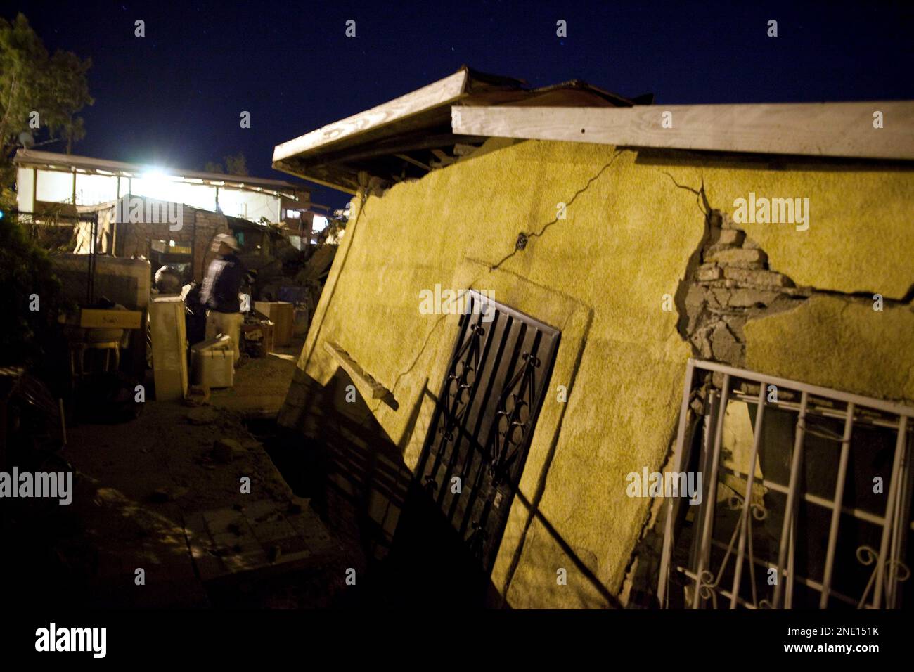 A man walks near his house after a powerful earthquake hit Mexicali ...