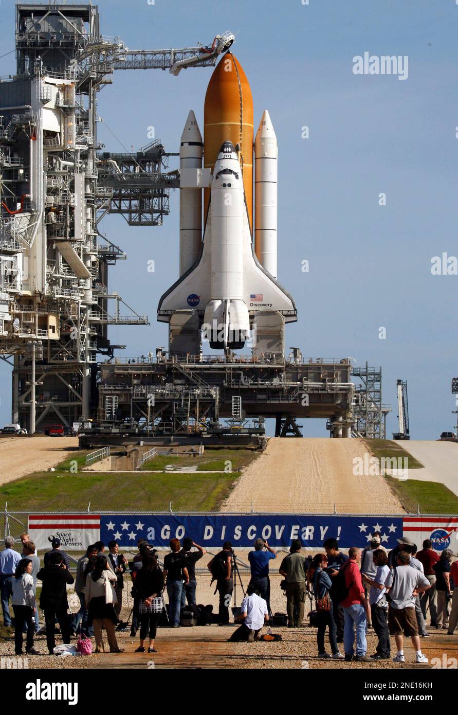 Photographers take pictures of the Space Shuttle Discovery after the ...