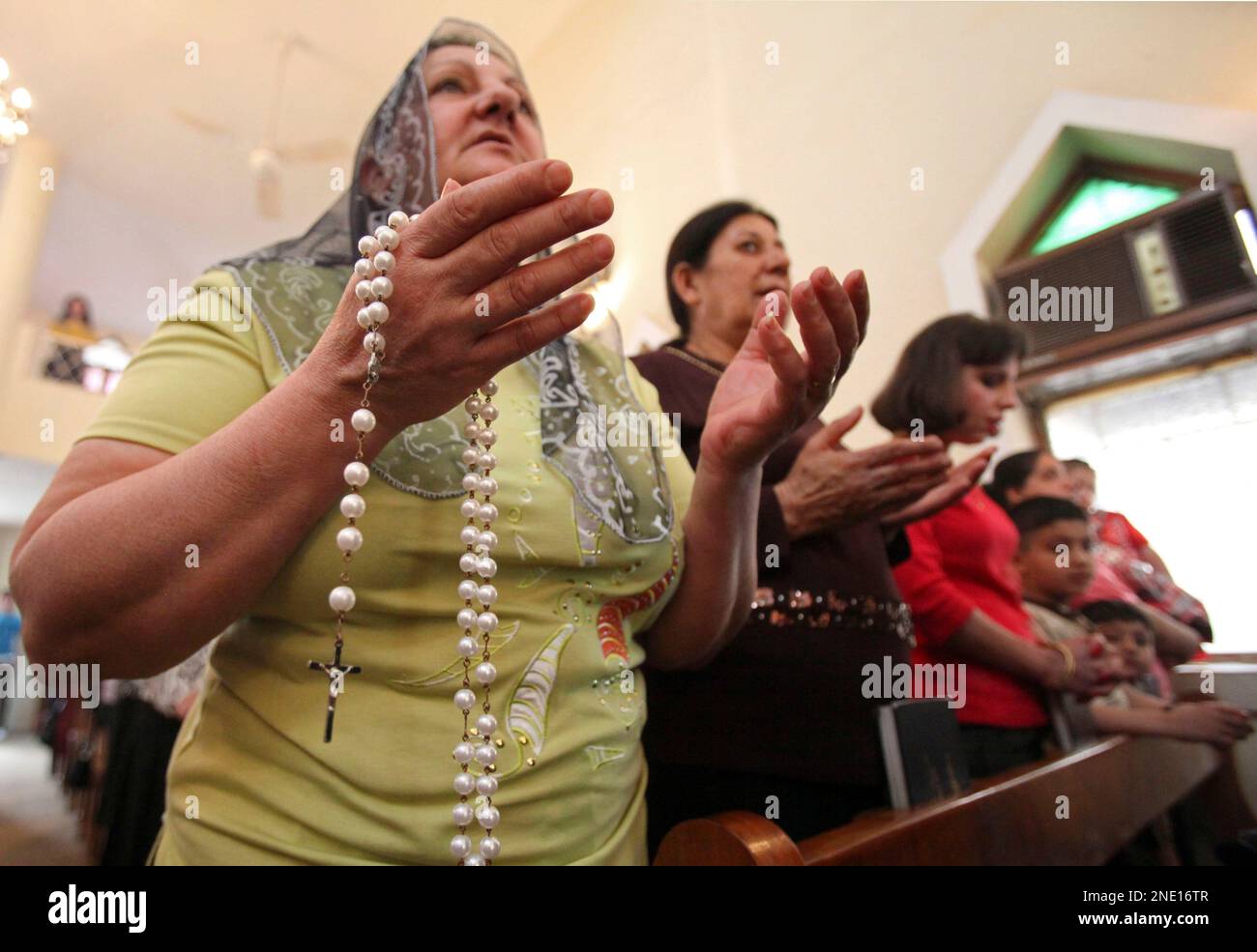 Iraqi Christians pray during Easter religious services at Virgin Mary ...