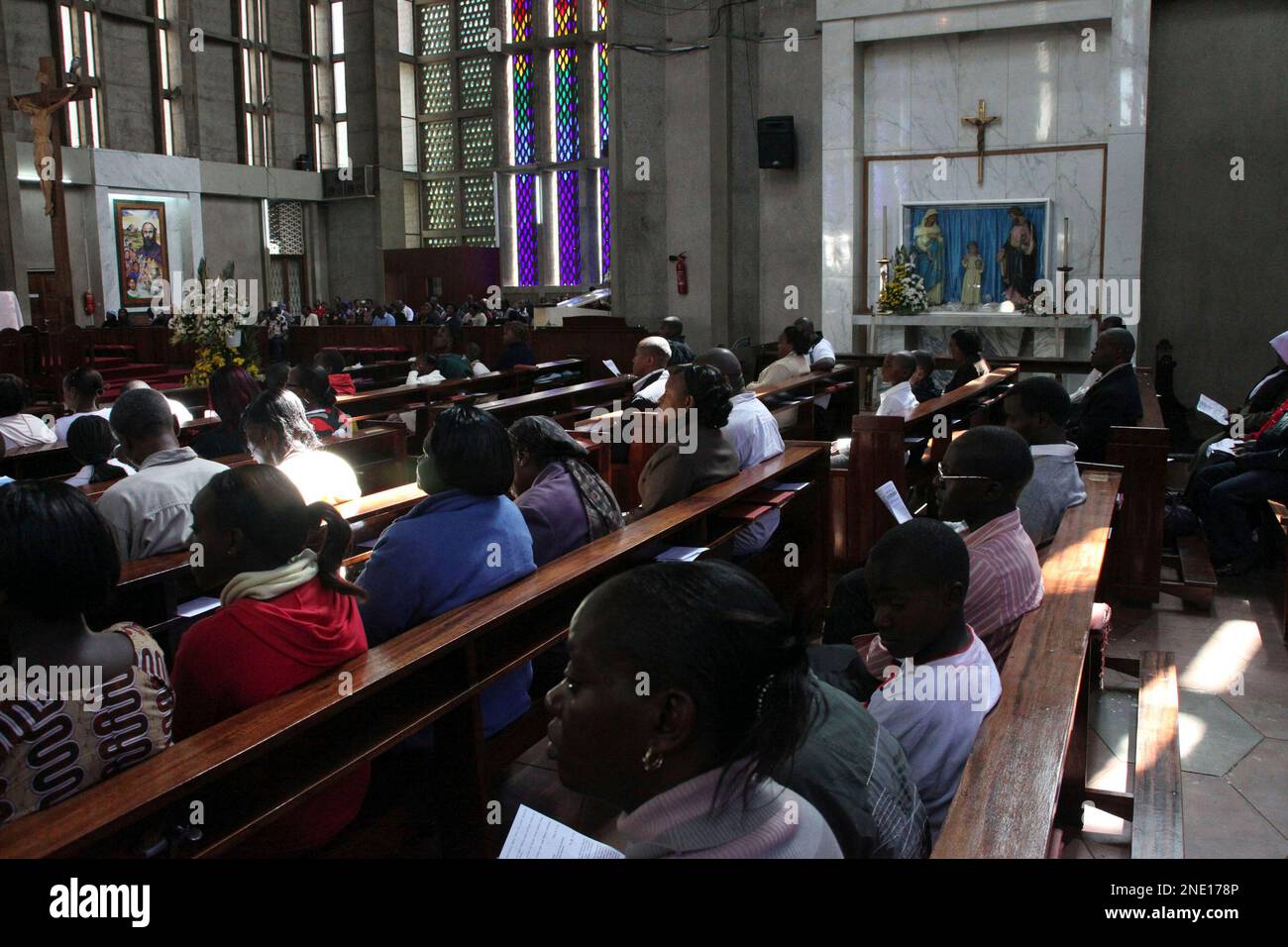 Kenyan Christian as they join a morning service at Holy Family Basilica ...