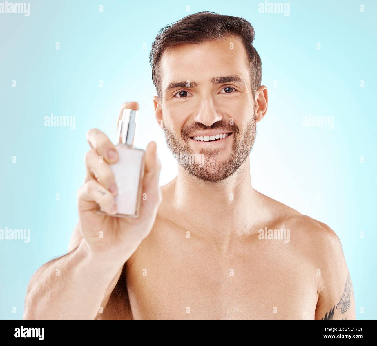 Beauty, portrait and man with perfume in a studio with a hygiene ...