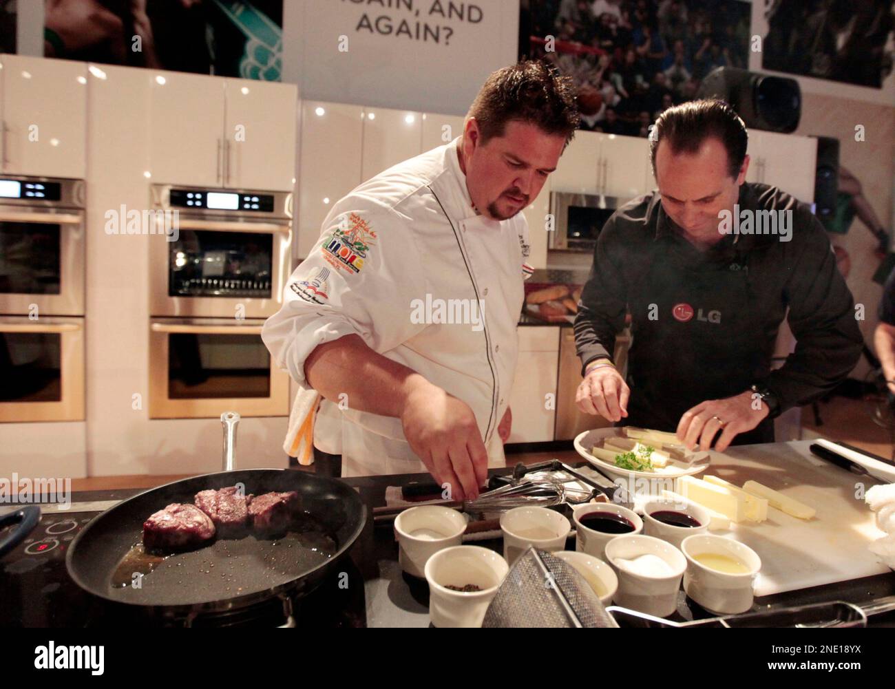 Notre Dame coach Mike Brey and his sous chef Jason Anderson cook during ...