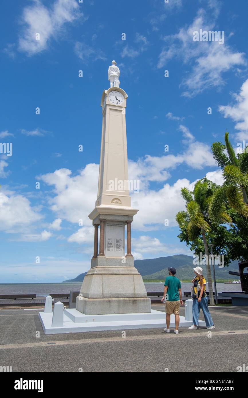 A young couple looking at the War memorial on Cairns Esplanade, Far ...