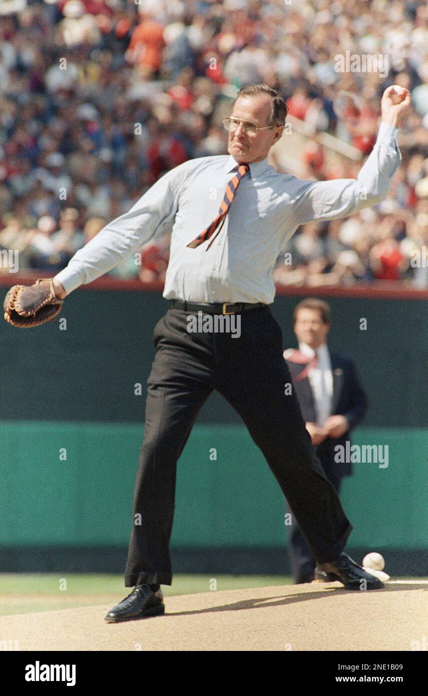 President George Bush throws out the ceremonial first pitch to mark the ...