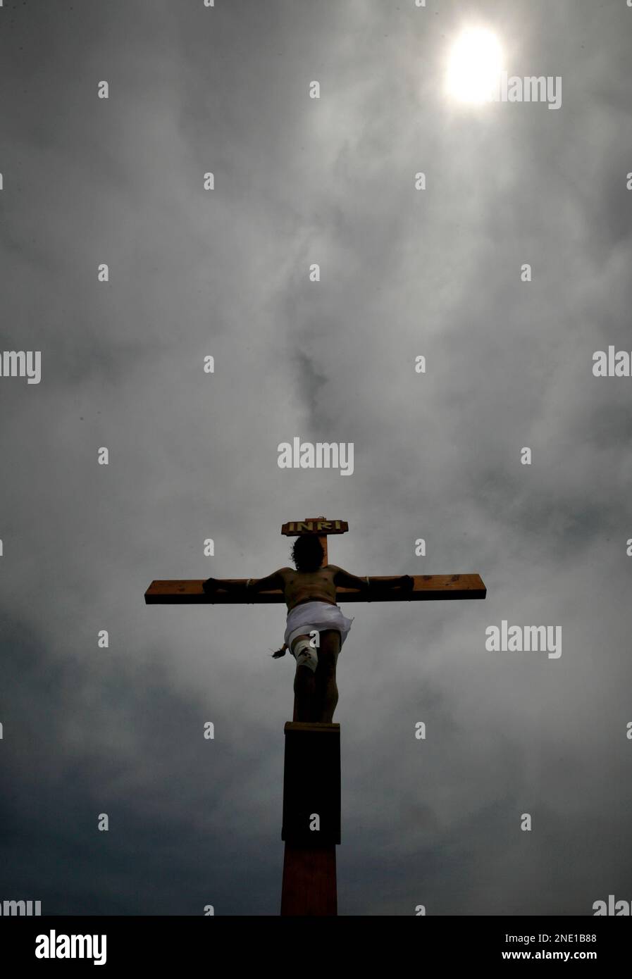 Juan Colin reenacts the crucifixion of Jesus on Good Friday during Holy ...