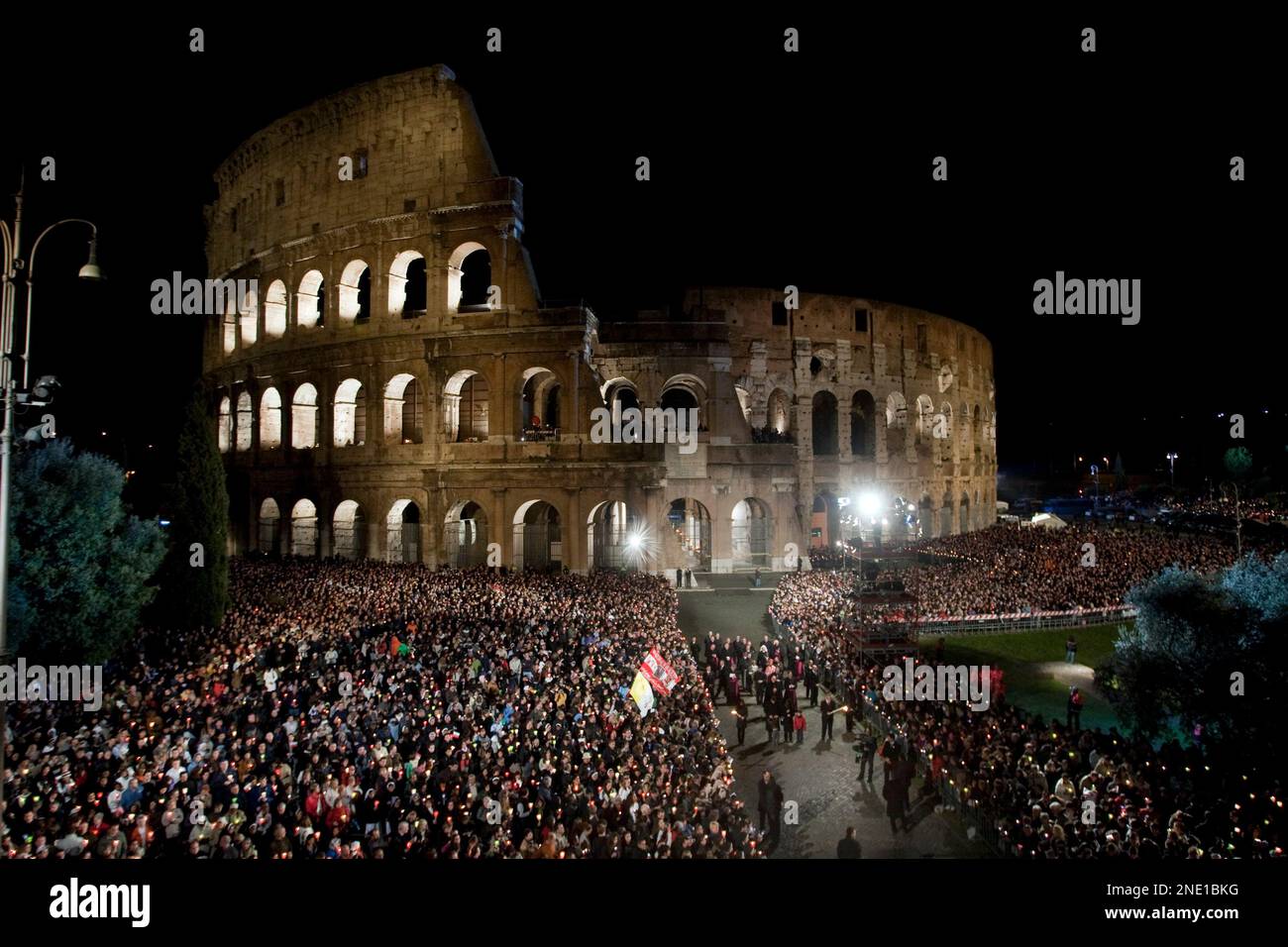 The faithful gather for the Via Crucis (Way of the Cross) procession on ...