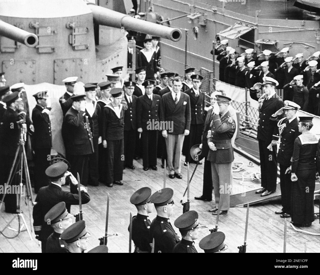British Prime Minister Winston Churchill (left foreground) salutes U.S ...