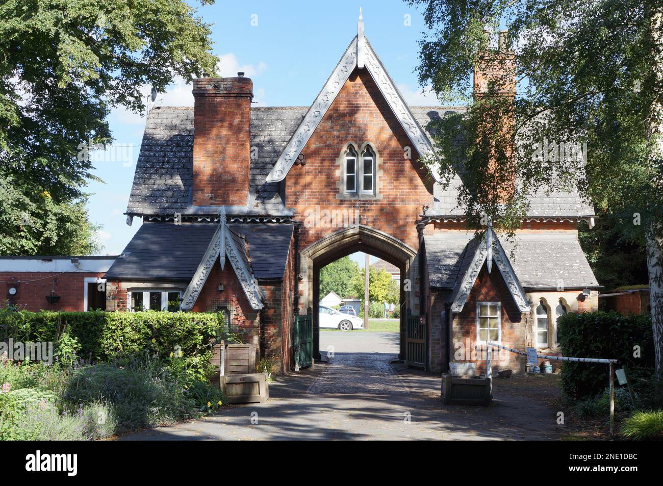 The gatehouse and arched entrance to the old victorian cemetery during ...