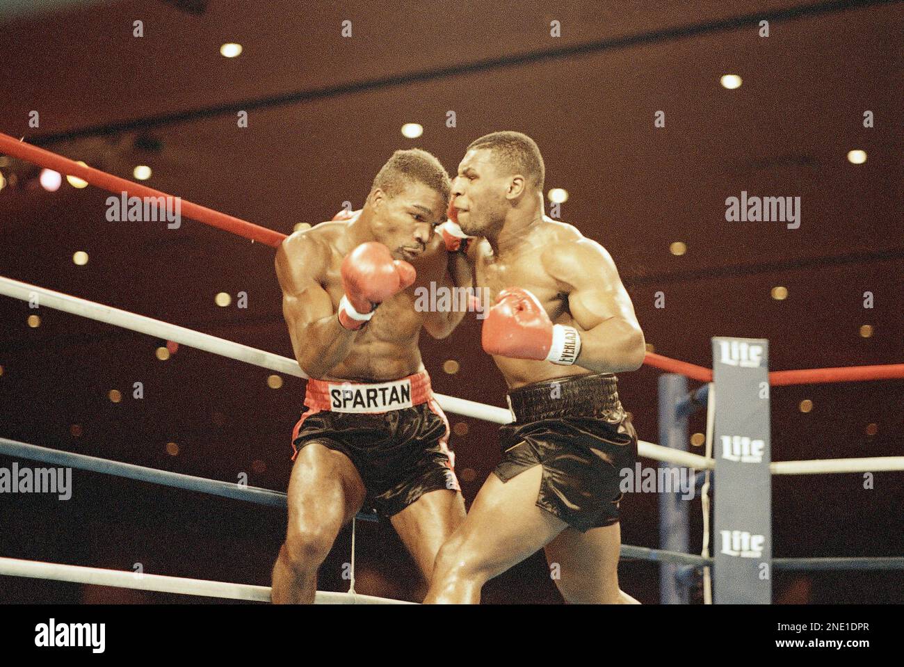 Heavyweight boxer Mike Tyson of New York works over Alfonzo Ratliff of ...