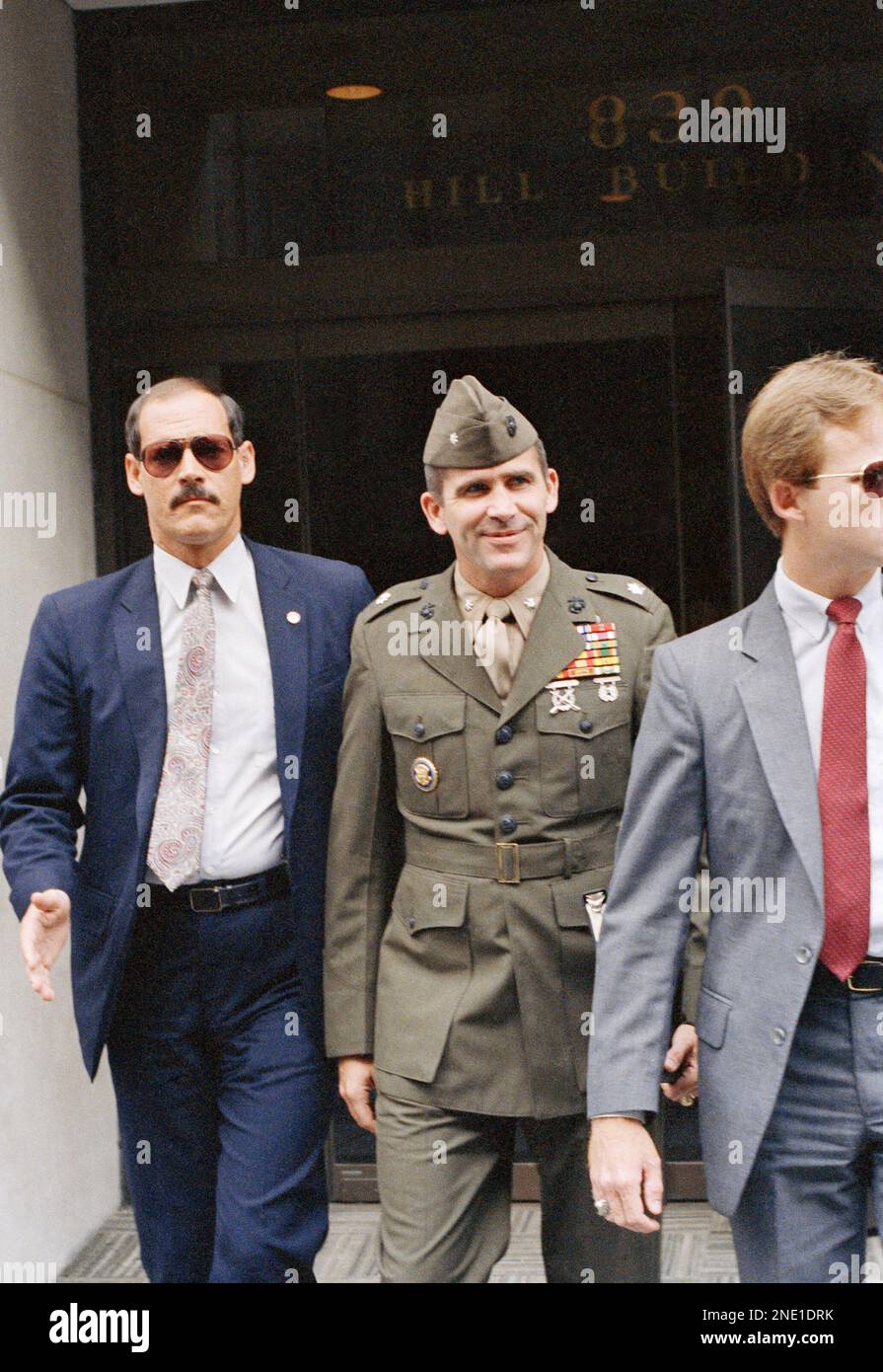 Walking looking away authority uniform hi-res stock photography and ...