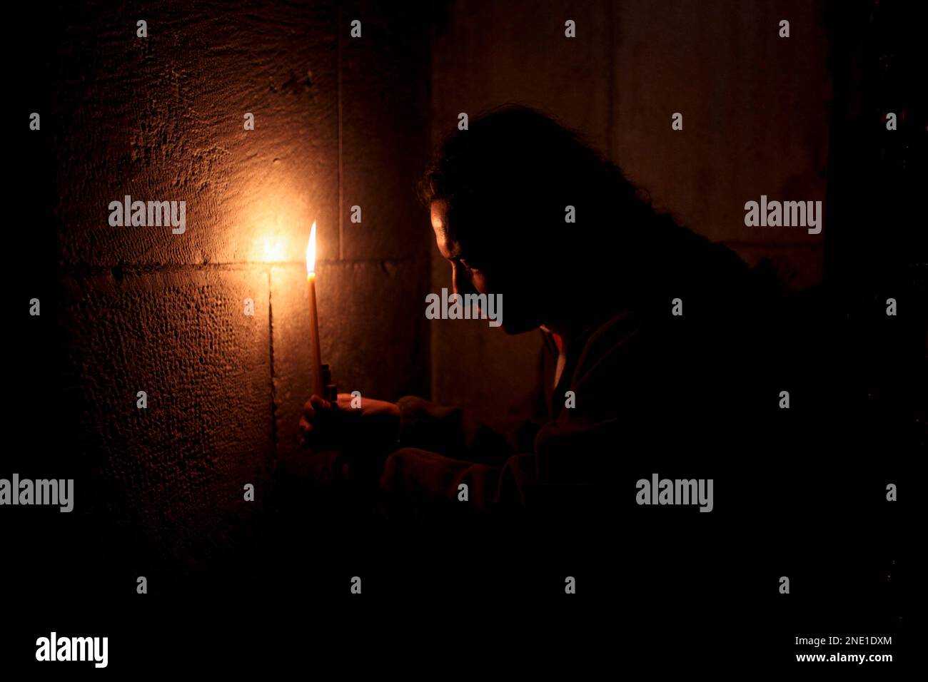 A Christian Orthodox pilgrim prays before Good Friday processions in ...