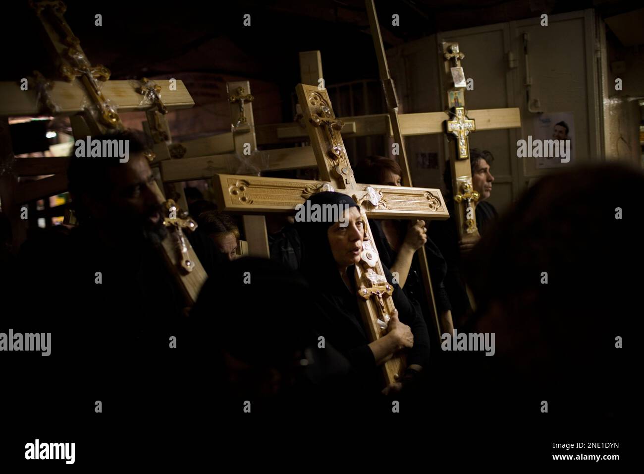 Christian Orthodox pilgrims hold crosses during Good Friday processions ...