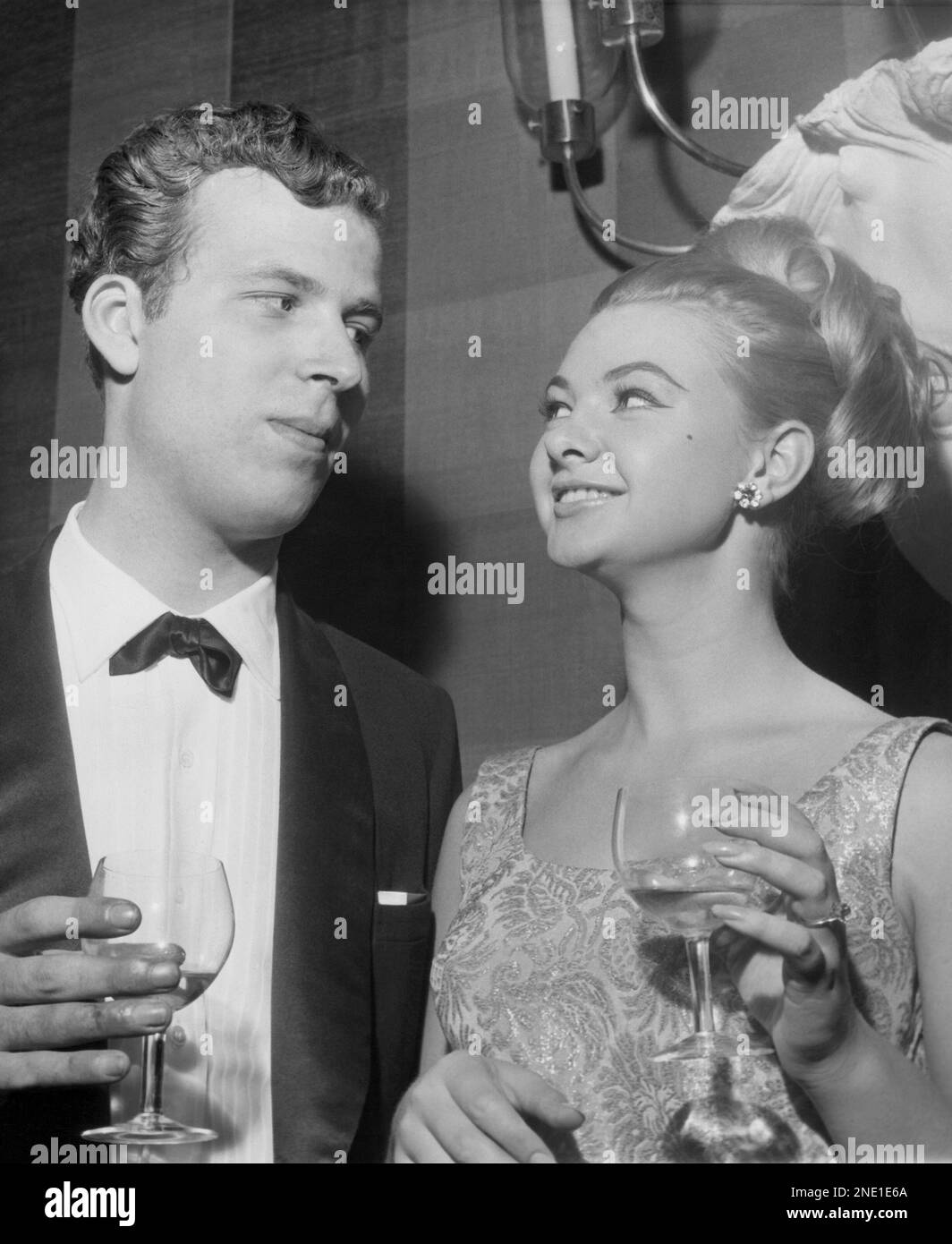 Mandy Rice-Davies, a key figure in the trial of Dr. Stephen Ward poses with her escort, Mr ...