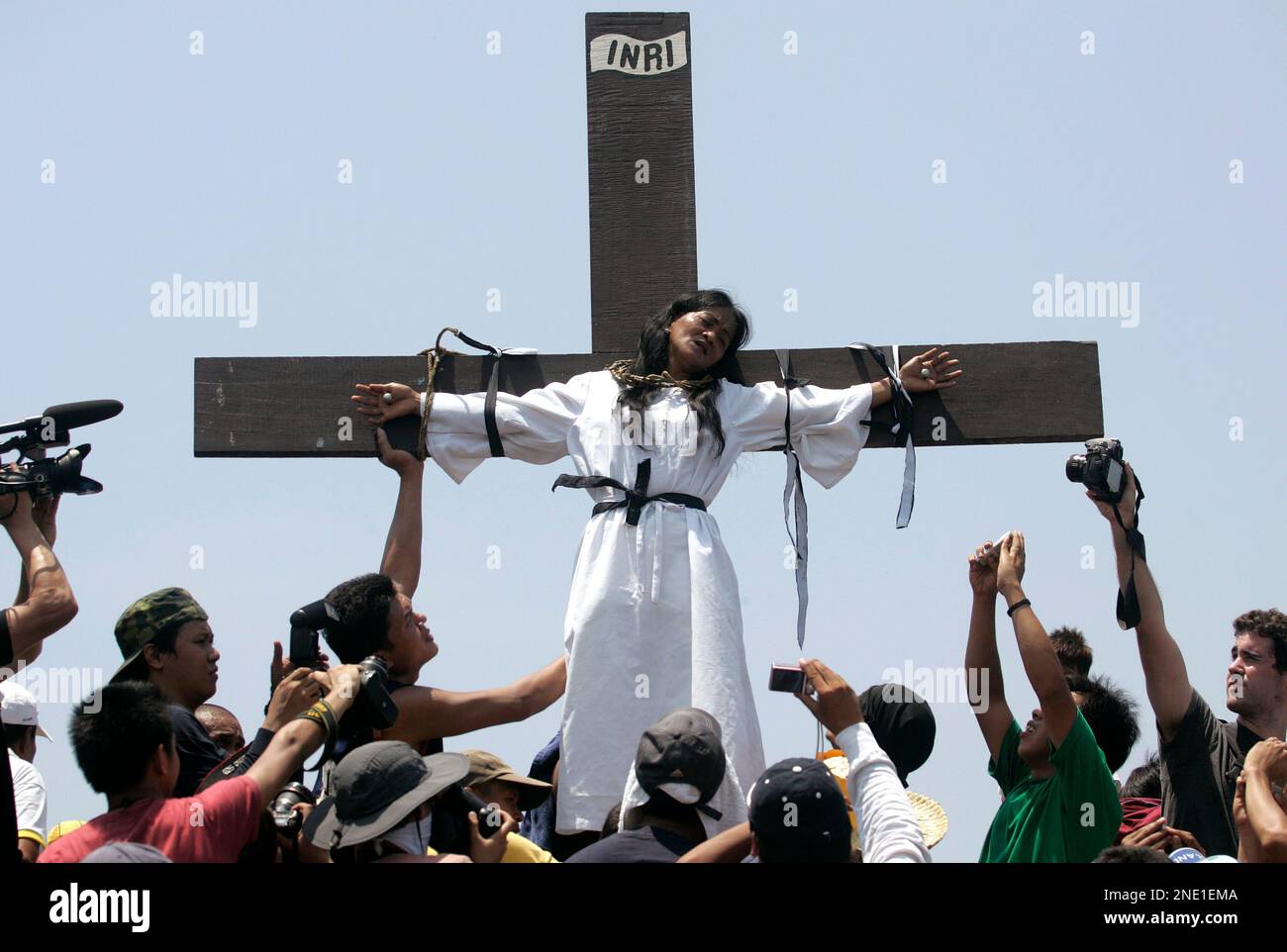 Tourists and media men train their cameras on 34-year-old rice cake ...