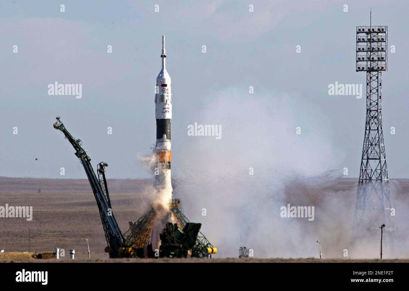 The Soyuz-FG rocket booster with the Soyuz TMA-18 spacecraft carrying a ...