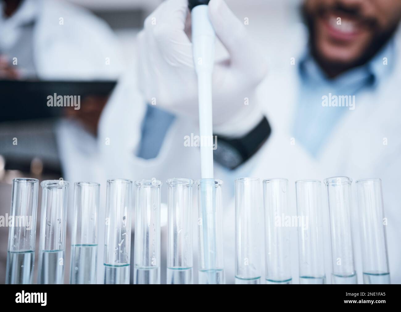 Science, liquid and test tube in laboratory for research, medicine ...