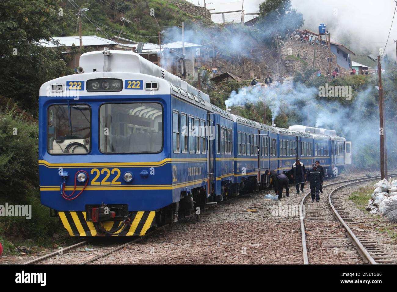 Workers prepare a train at Piscacucho train station before a tour to ...