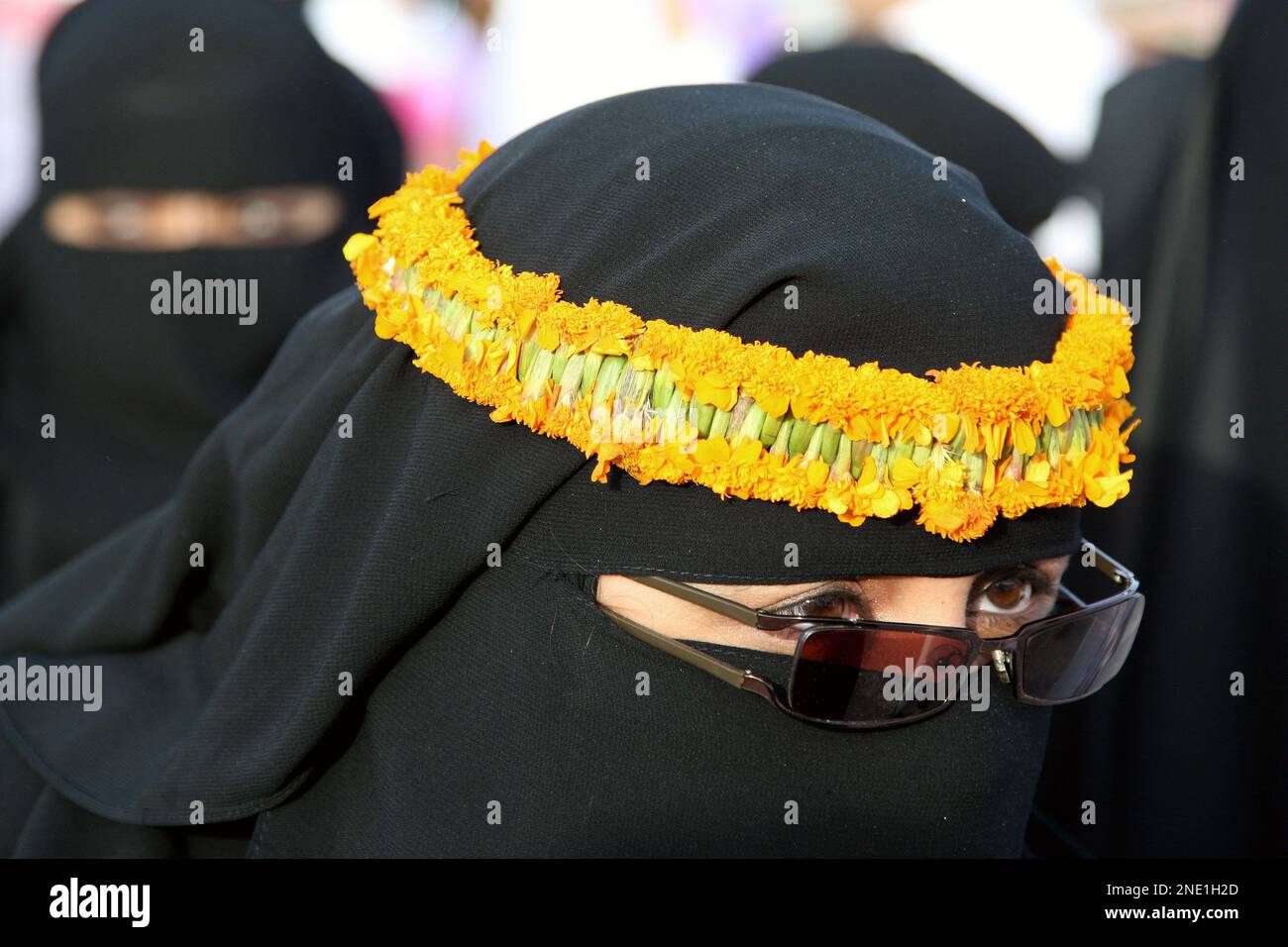 A Saudi woman attends the traditional Arda dance, or War dance, during ...